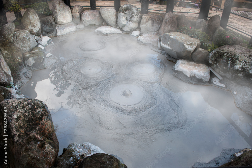 Oniishi bozu jigoku (Mud Hell), hot boiling grey bubbles mud pond in ...