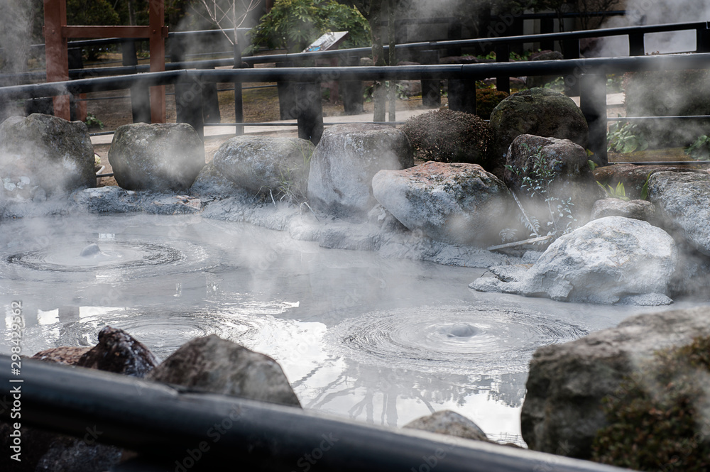 Oniishi bozu jigoku (Mud Hell), hot boiling grey bubbles mud pond in ...