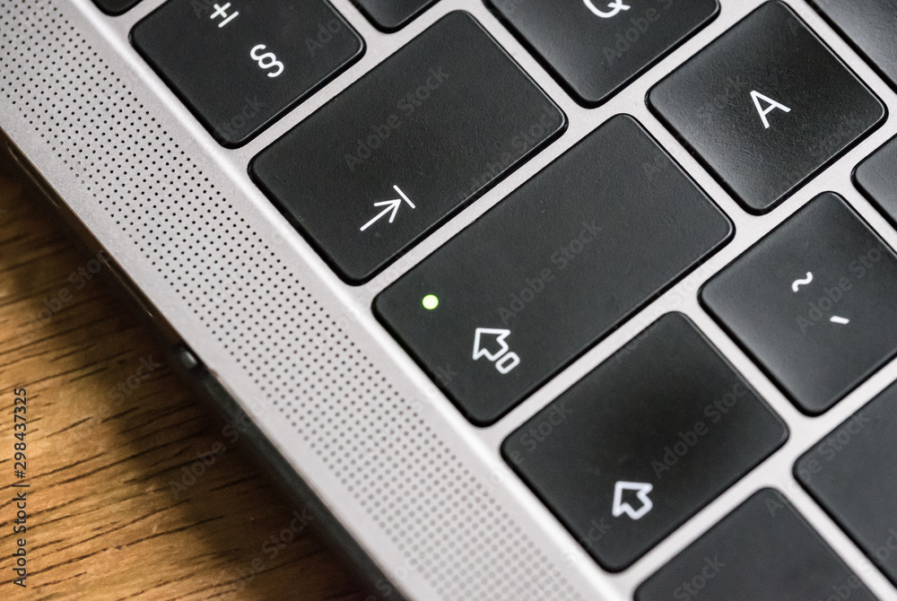 Close-up image of a well-known, luxury notebook computer showing detail ...