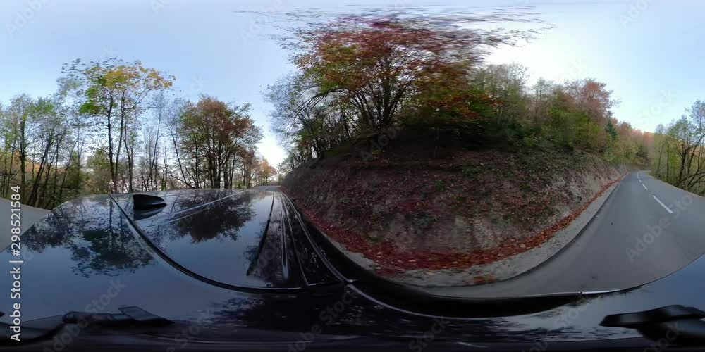 Virtual reality 360 degree view of car driving on a asphalt road in a ...
