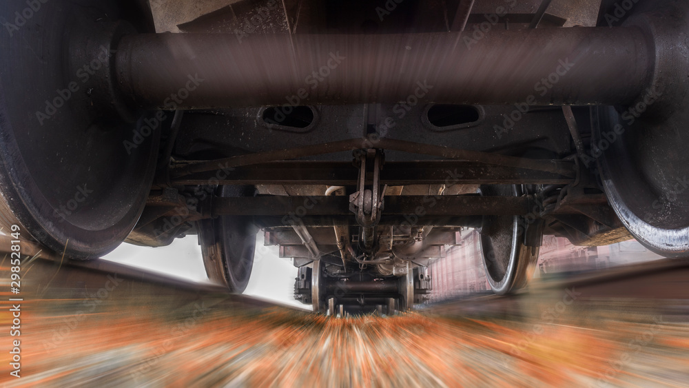 View from under the train traveling fast by rail. Wheels of a freight ...