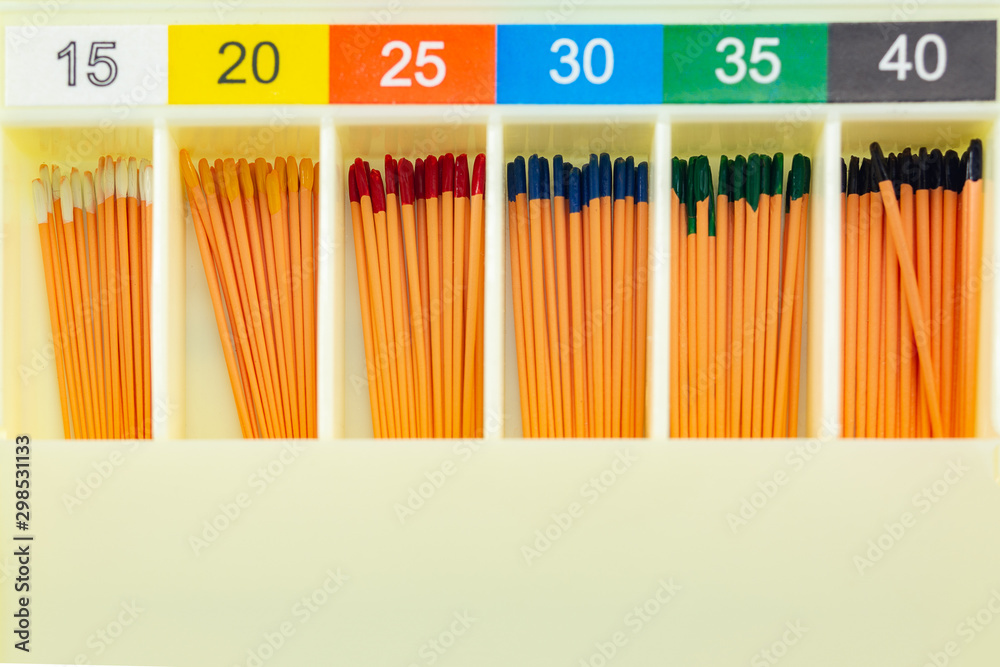 gutta-percha pins in a set of different sizes for root canal filling ...