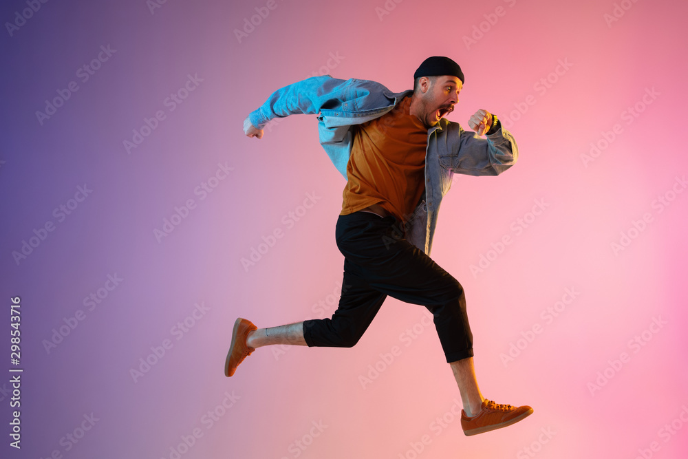 Full length portrait of happy jumping man wearing casual clothes in ...