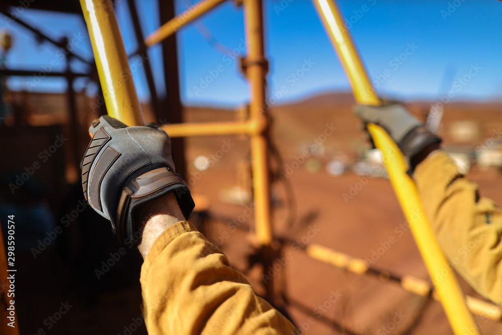 Side view close up good safety practice of male miner wearing a safety ...