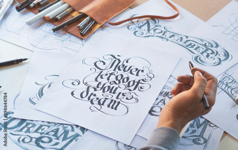Typography Calligraphy artist designer drawing sketch writes letting ...