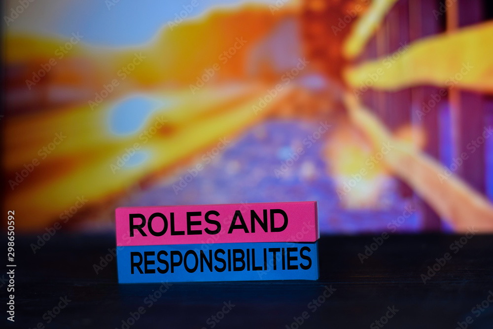 Roles and Responsibilities! on the sticky notes with bokeh background ...