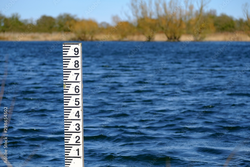 River and Lake water level marker scale seen partially submerged with a ...