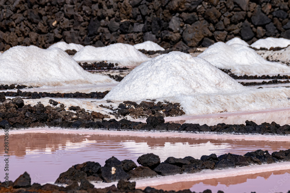 Salt piles and the different colours of water basins during the ...
