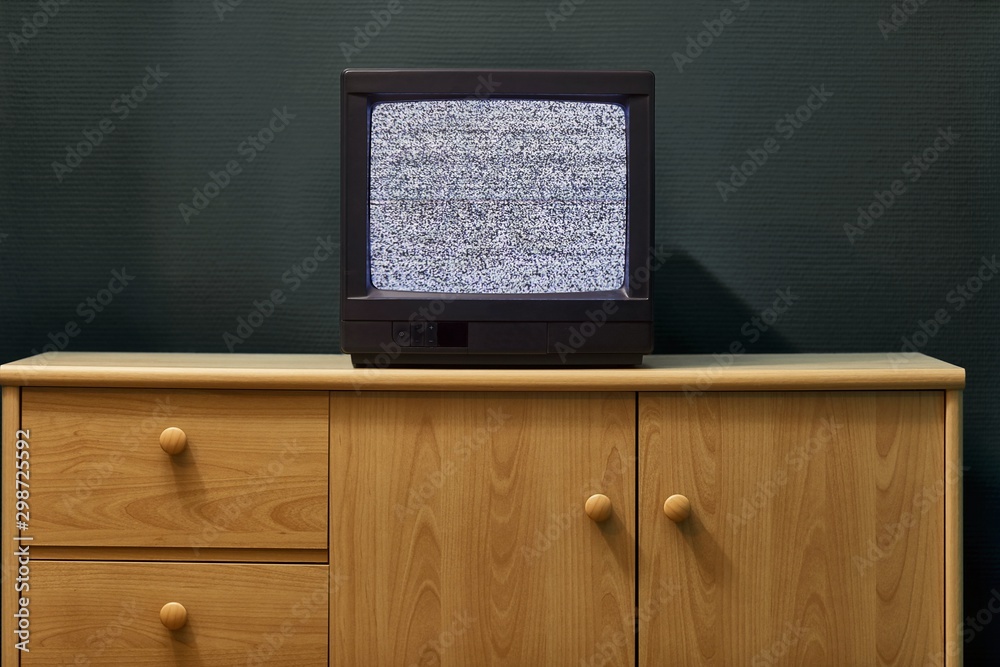 Small old TV set with no signal noise in a dim room Stock Photo | Adobe ...