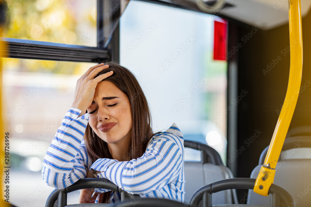 Stockfoto med beskrivningen Worried young woman traveling inside of a ...