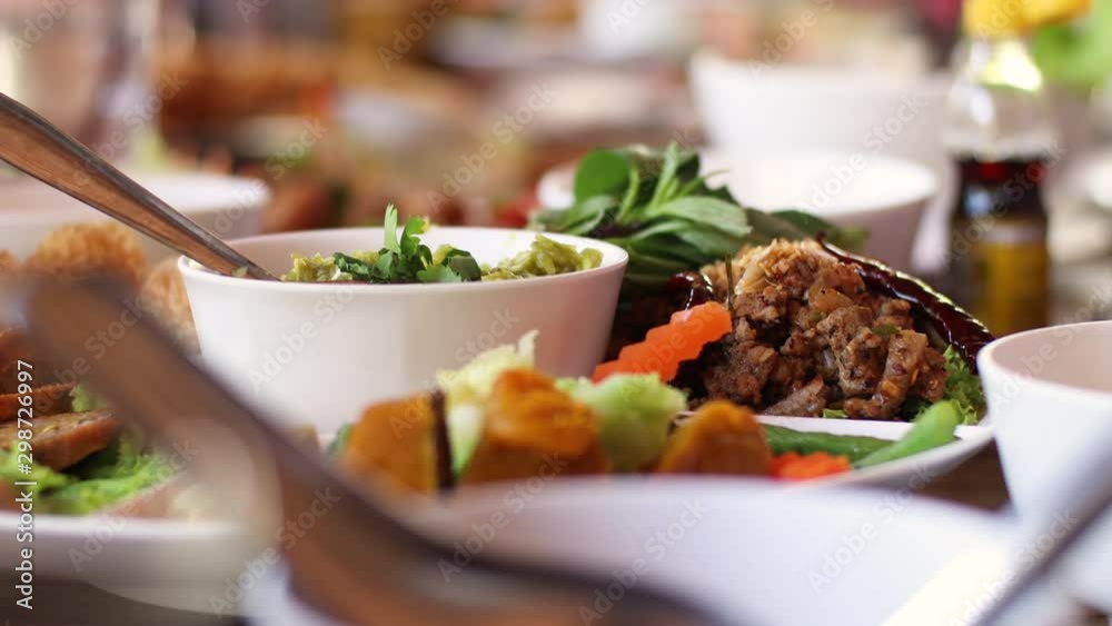 4k close up Thai foods on the table at outdoor restaurant, day time ...
