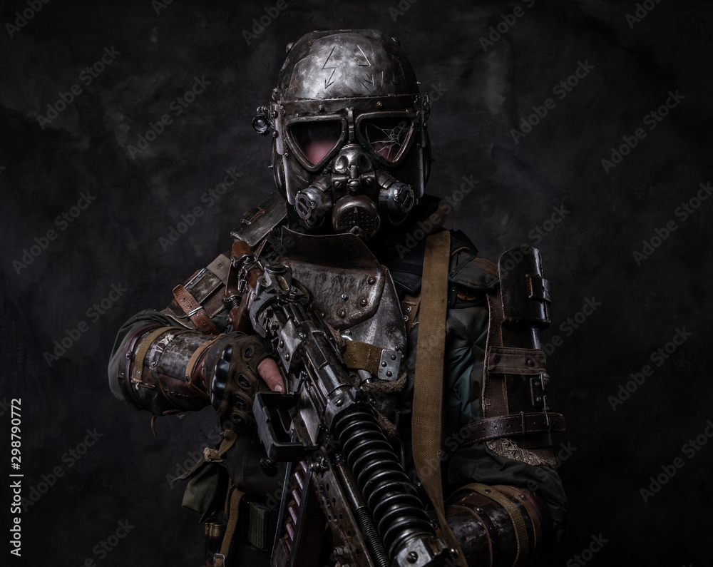 Cool cosplay costume of post - apocalypse knight, man is posing at dark ...