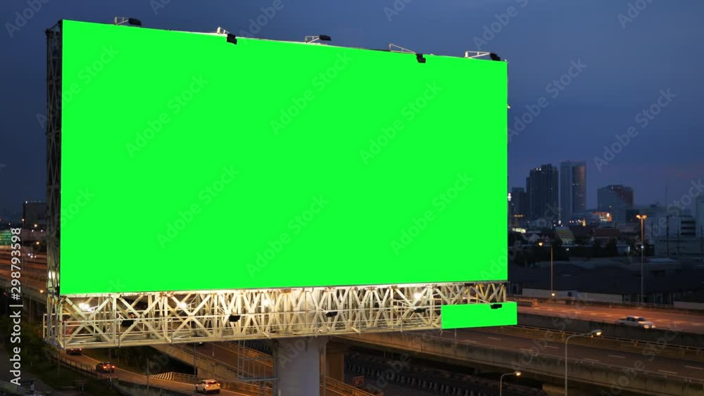 Green screen of advertising billboard on expressway during the twilight ...