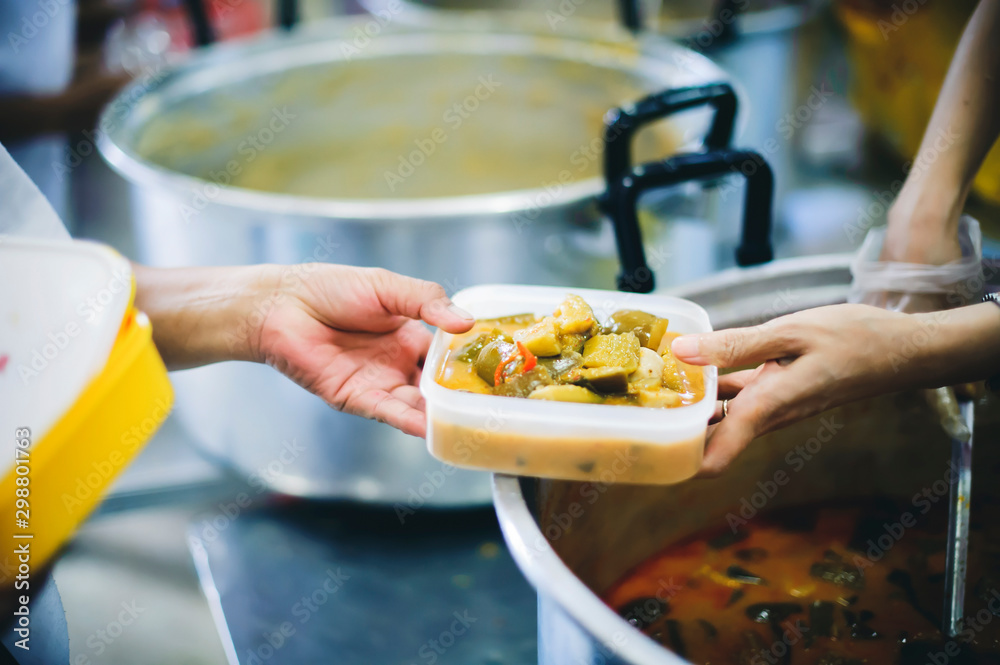 Helping the poor in society by sharing food. Charity : The concept of ...