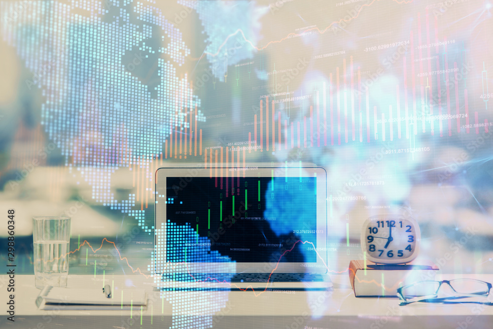 Stock market chart hologram drawn on personal computer background ...