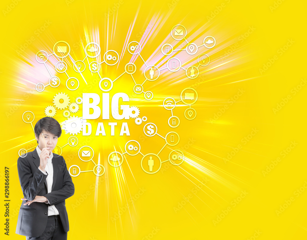 Young asian business person standing with pencil in hand and thinking about big data and many ...