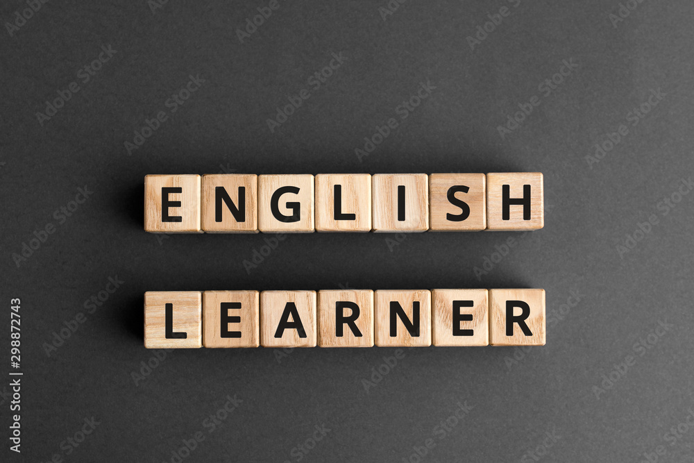 English learner - phrase from wooden blocks with letters, student ...