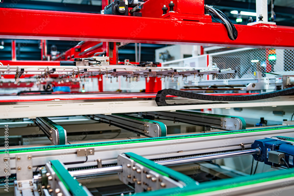 production of solar panels, man working in factory. Closeup of special ...