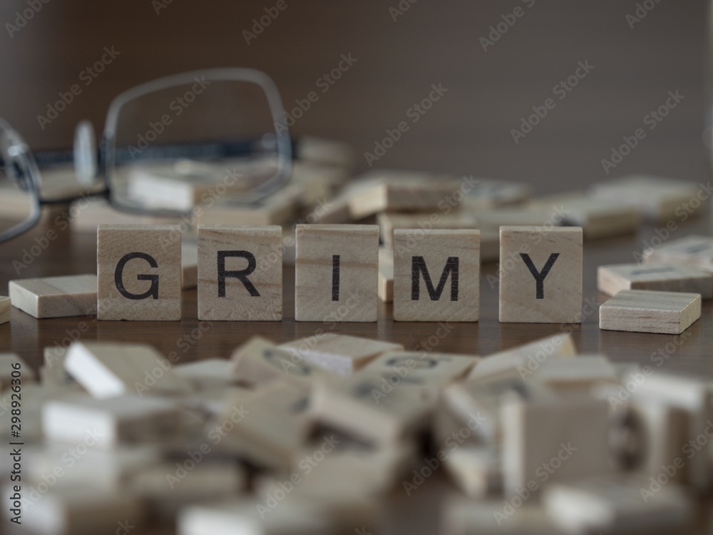 The concept of Grimy represented by wooden letter tiles Stock Photo ...