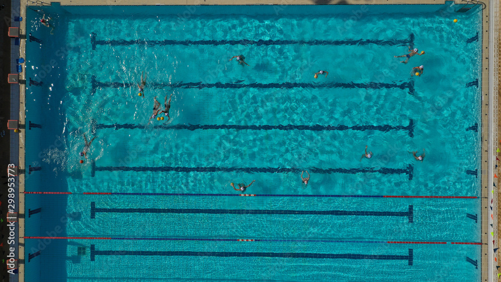 Aerial top view photo of people swimming and practising in outdoor pool ...