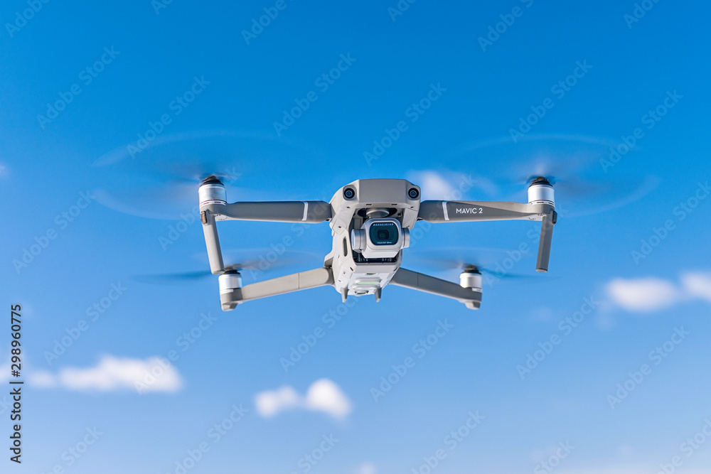 DJI Mavic 2 pro drone during flight against blue sky Stock Photo ...