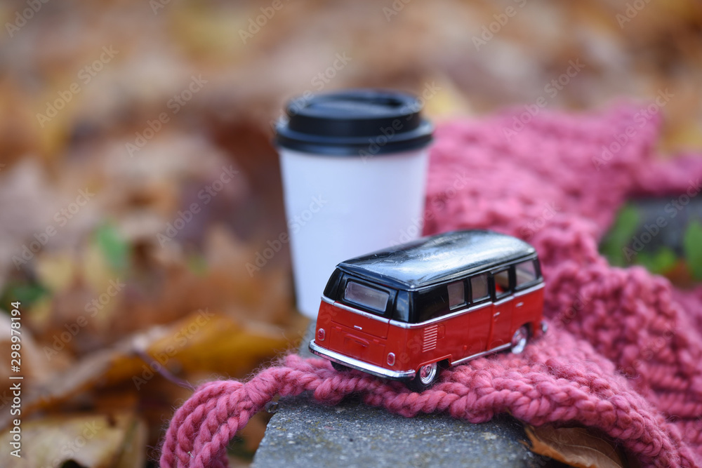 Little red bus. Toy school bus. on an autumn yellow background. Bright ...