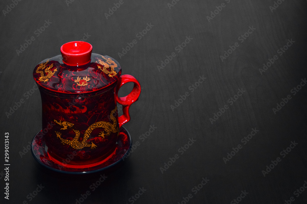 Chinese golden dragon on a red porcelain teapot with a red cap. Dishes ...