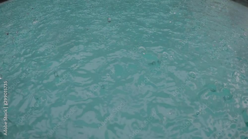 Video of rain splashing into pool. Storm in Panama City. Close up of ...