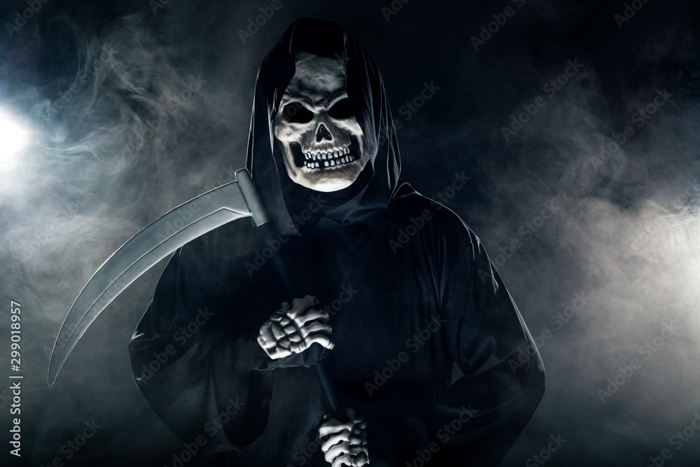Scary looking grim reaper ghost wielding a scythe or sickle coming out ...