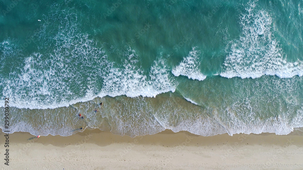 Beach on aerial drone top view with ocean waves reaching shore. Stock ...