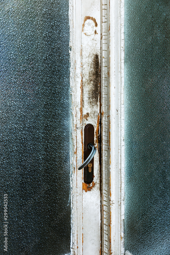 old wooden door in poor quarter. Ancient vintage wooden in an old wall ...