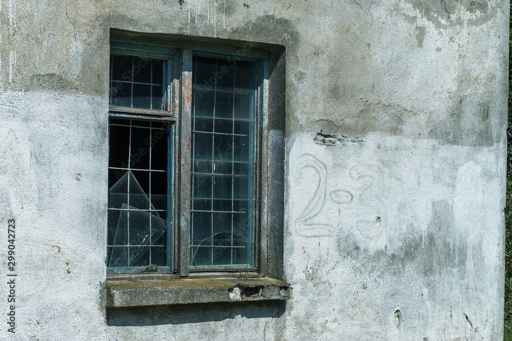 Broken windows in an old abandoned brick building. Old windows of ...
