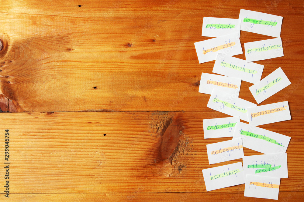 Different English words written in notes for remembering exercise ...