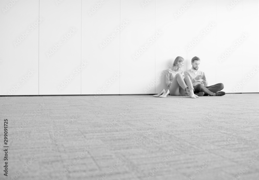 Black and white phoyo of business people sitting on the floor during ...