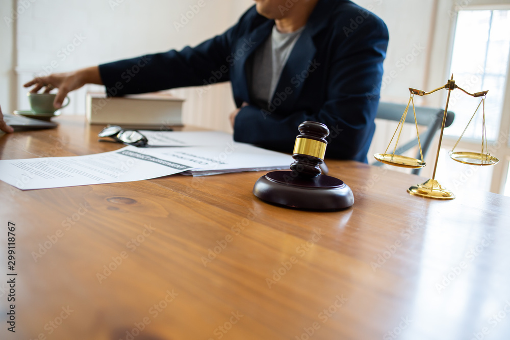 The lawyer is explaining the principles of law for people who come to ...