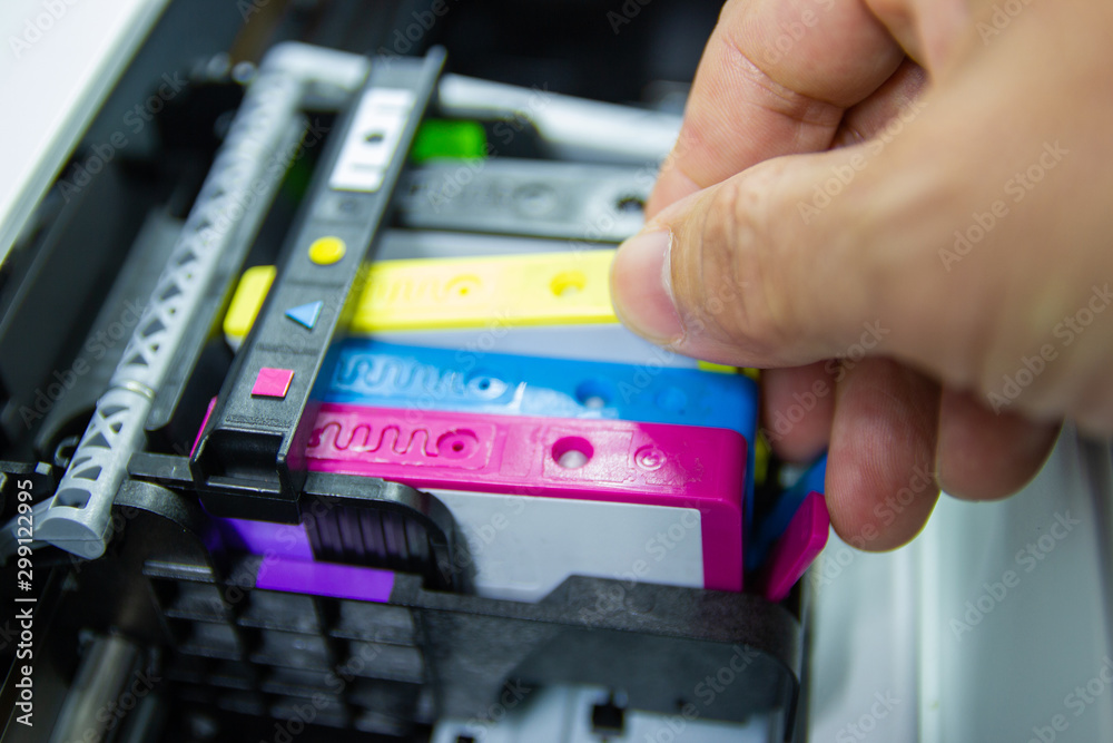 Technicians are install setup the ink cartridge of a inkjet printer the ...