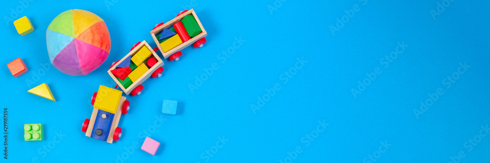 Baby kids toys banner background. Wooden train, soft ball and colorful ...