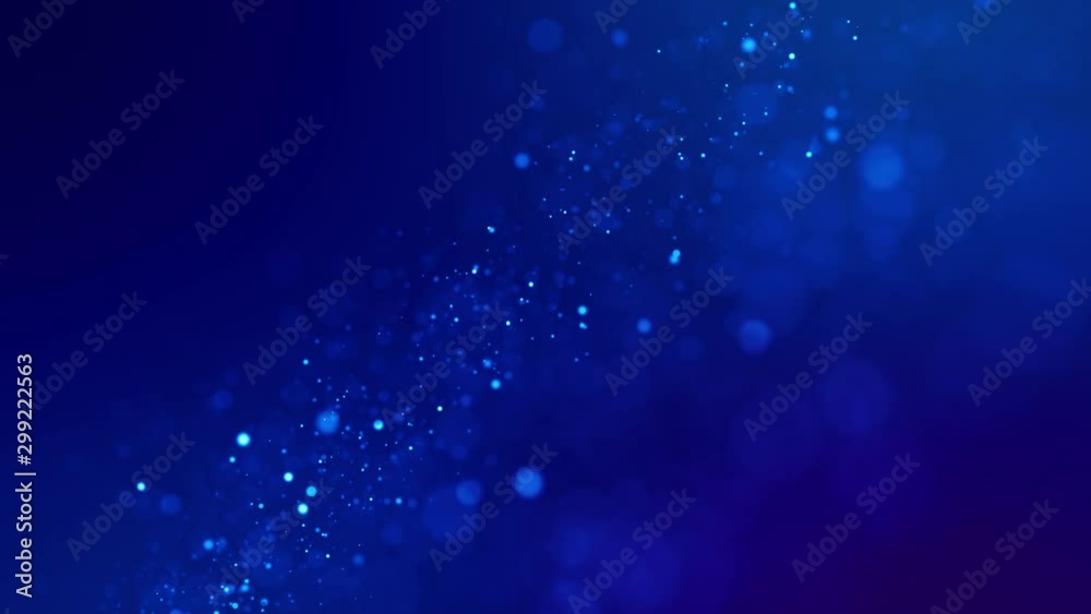 glitter blue magic particles fly and glow in viscous liquid with ...