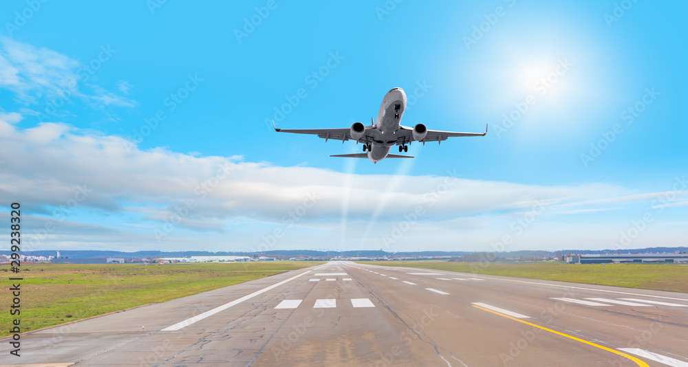 White Passenger plane fly up over take-off runway from airport Stock 写真 ...