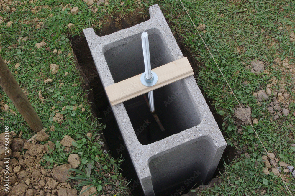 formwork block with threaded rod spindle in the ground as fundament ...