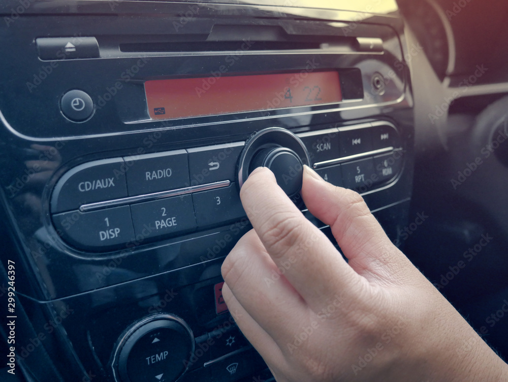 Driver's Hand Press Button on Car Radio Stock Photo | Adobe Stock