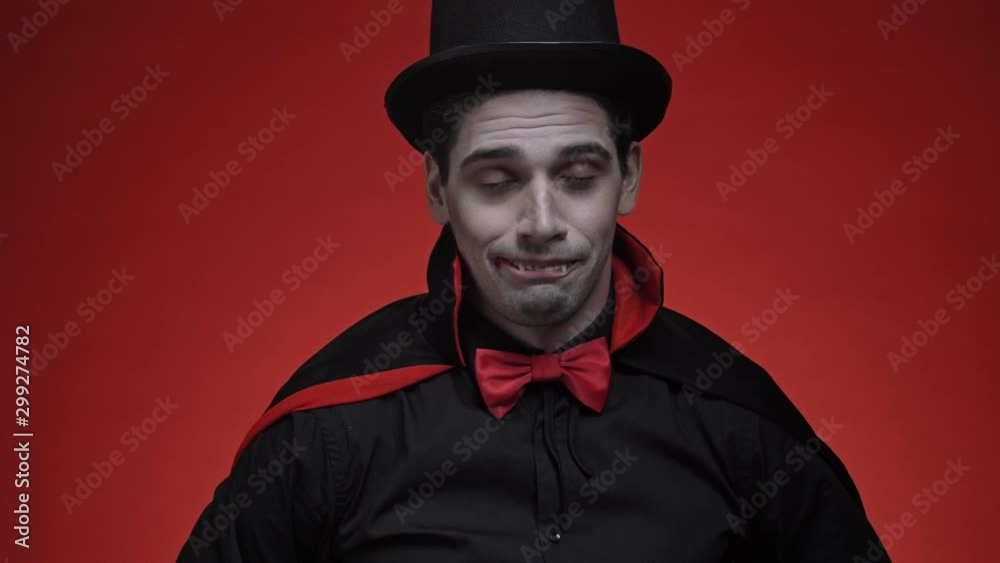 Scary vampire man with blood and fangs in black halloween costume ...