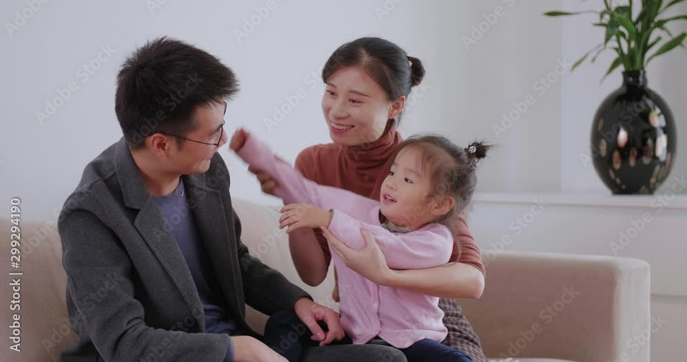 Mother and daughter playing with father happy asian family at home ...