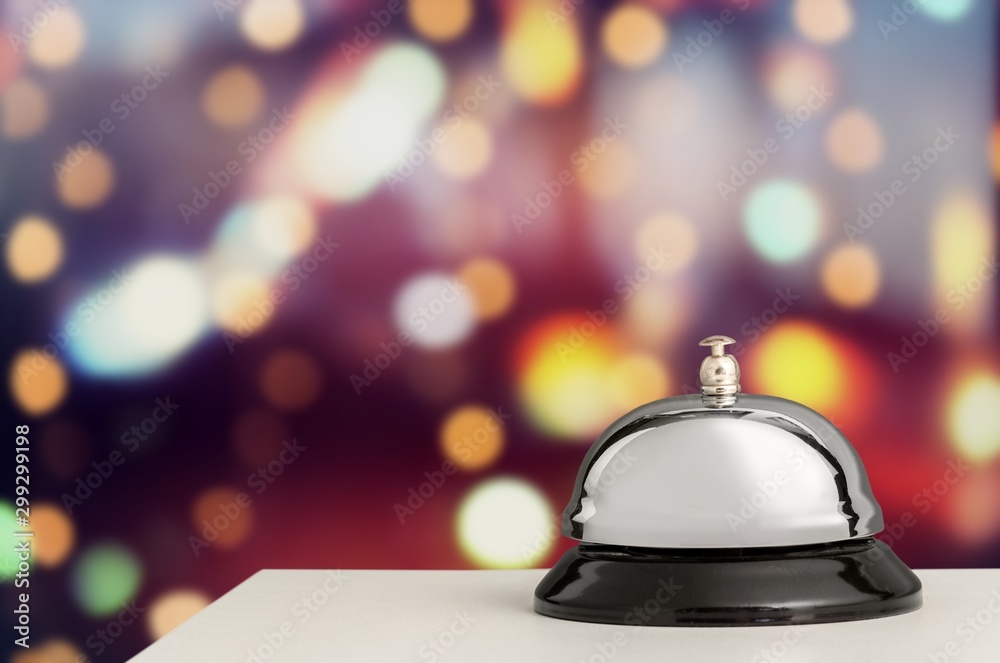 Vintage hotel reception service desk bell on blurred background, bokeh Stock Photo | Adobe Stock