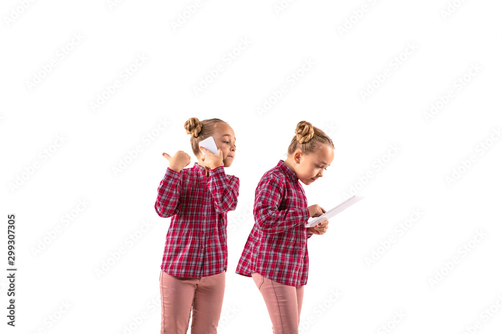 Young handsome girl arguing with herself on white studio background ...