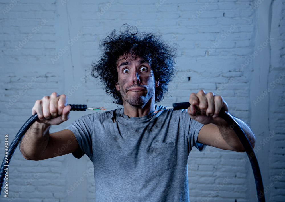 Funny image of man getting electric shock with funny face and smoke all ...