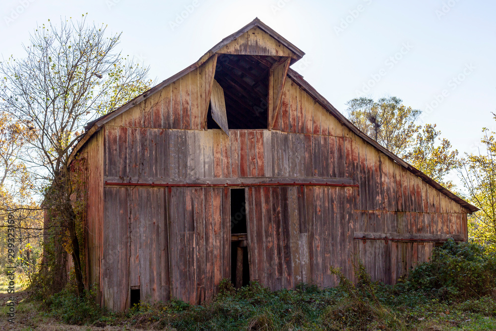 old run down barn with faded weathered paint Stock Photo | Adobe Stock