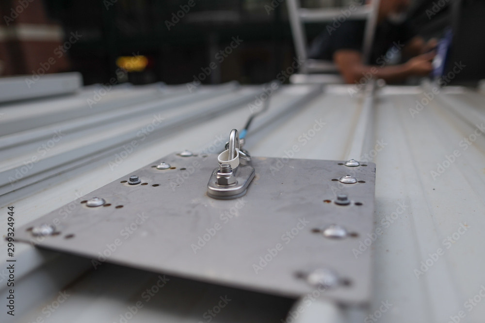 Defocused of construction worker safe himself into first man up line ...