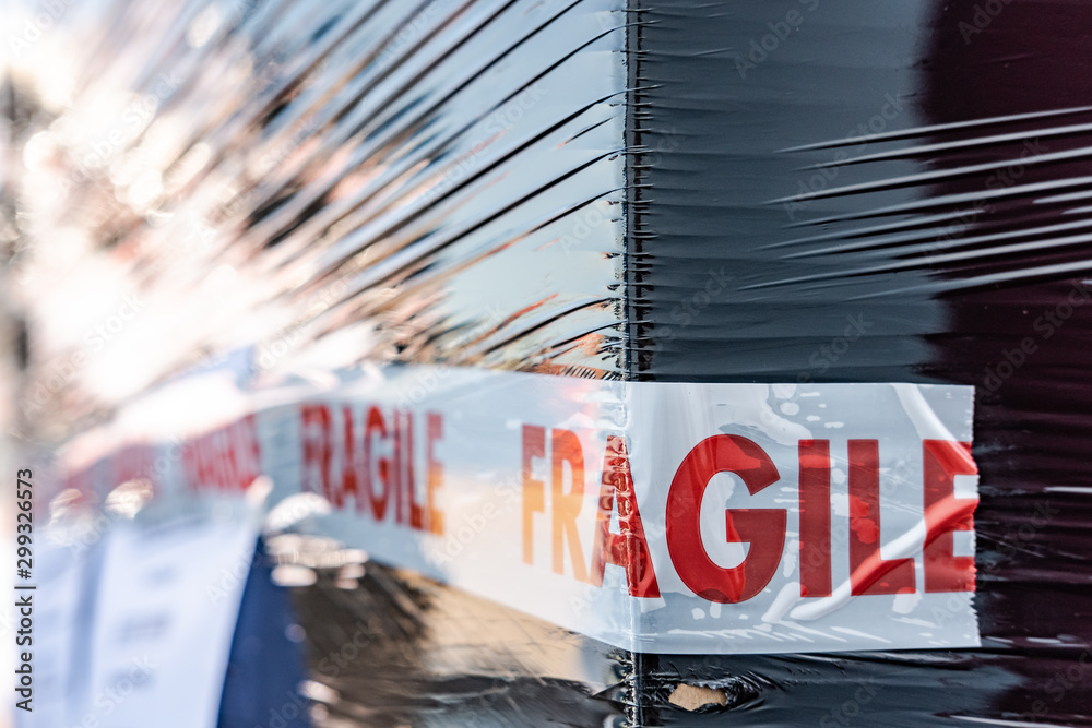 Shallow focus of tall heavy goods seen outside a dispatch warehouse ...