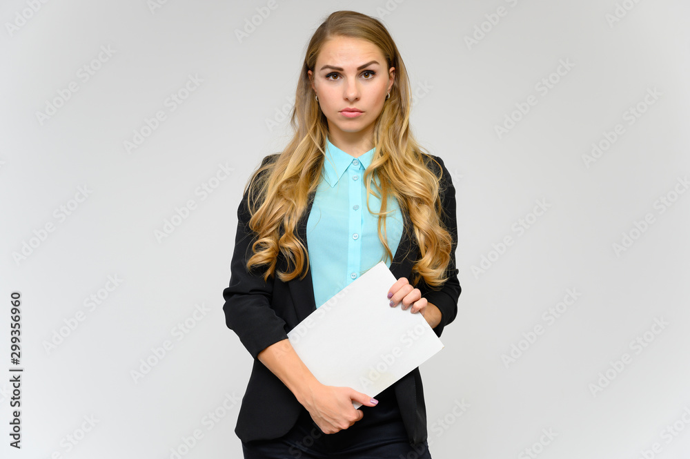 Portrait of a pretty blonde girl financial secretary with long curly ...